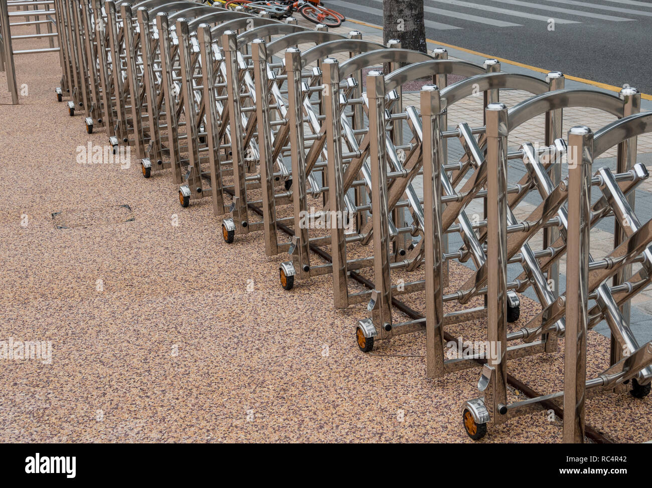 Expanding metal barrier in China Stock Photo - Alamy