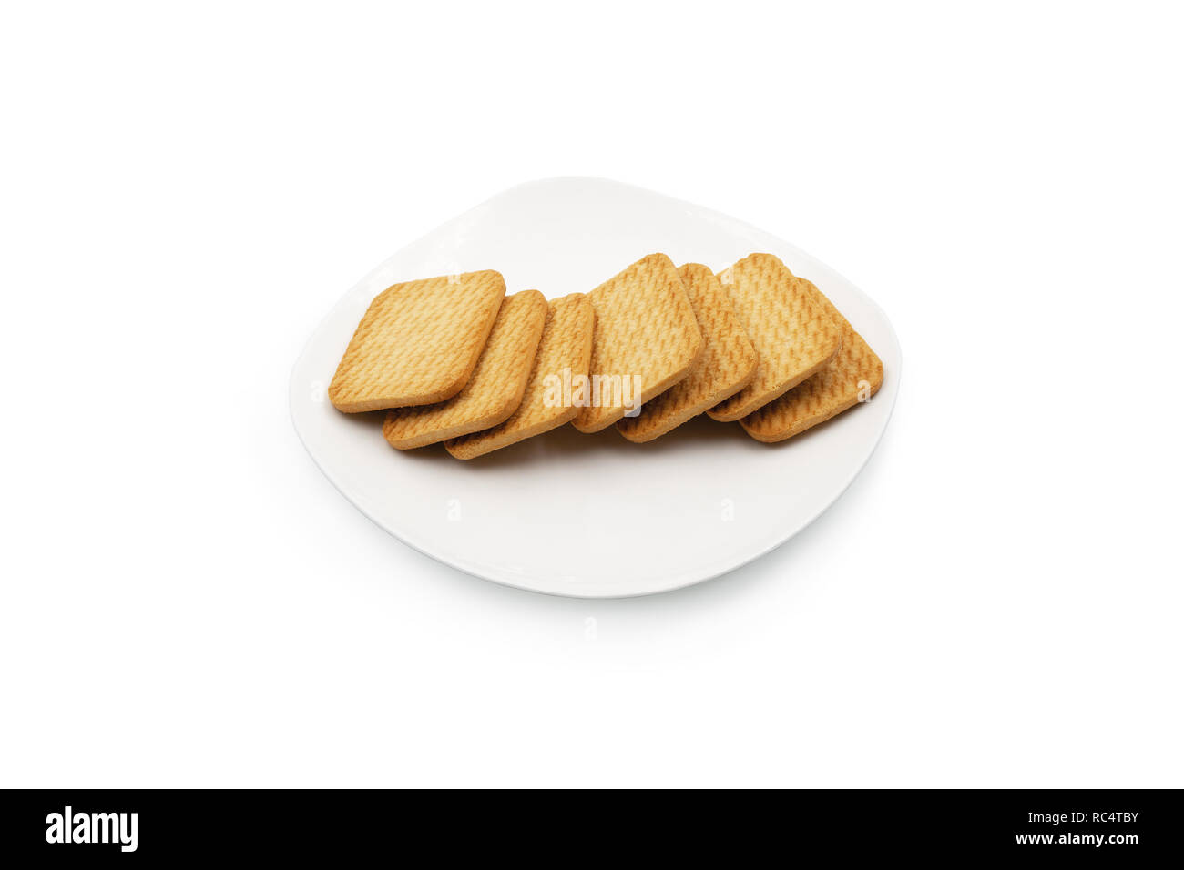 Square cookies on a white plate. Isolated on white background Stock ...