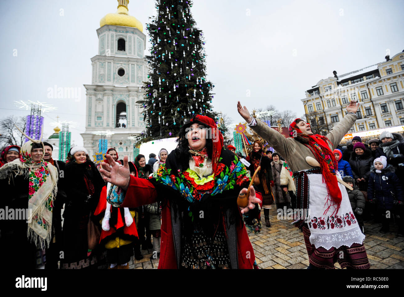 Ukrainians dressed in folk costumes are seen celebrating during the ...