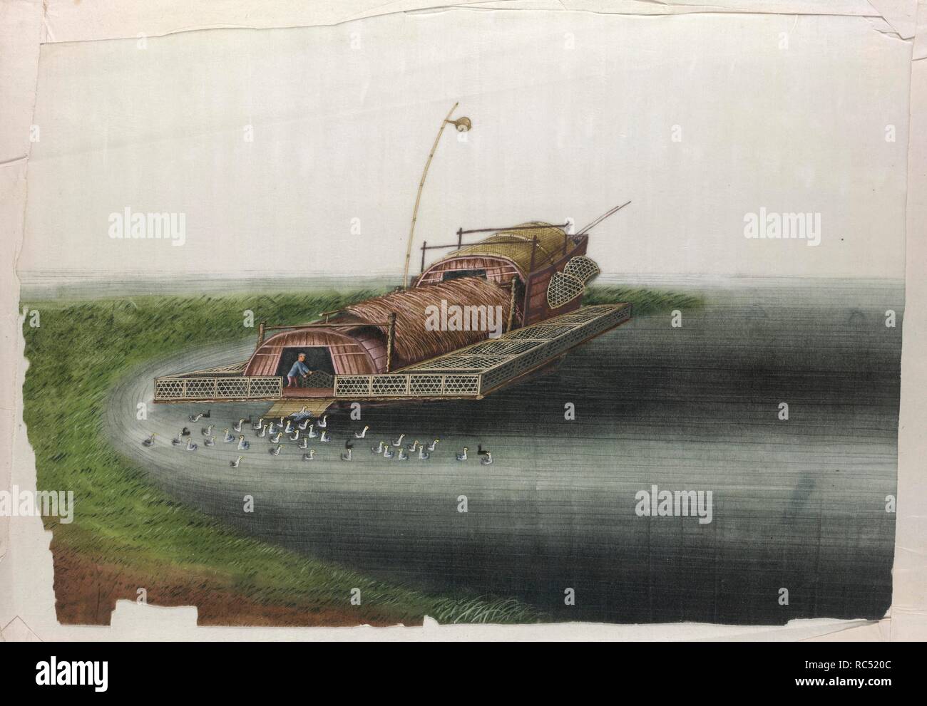 Houseboat on a river. A floating boat with a covered section. Birds. In ...