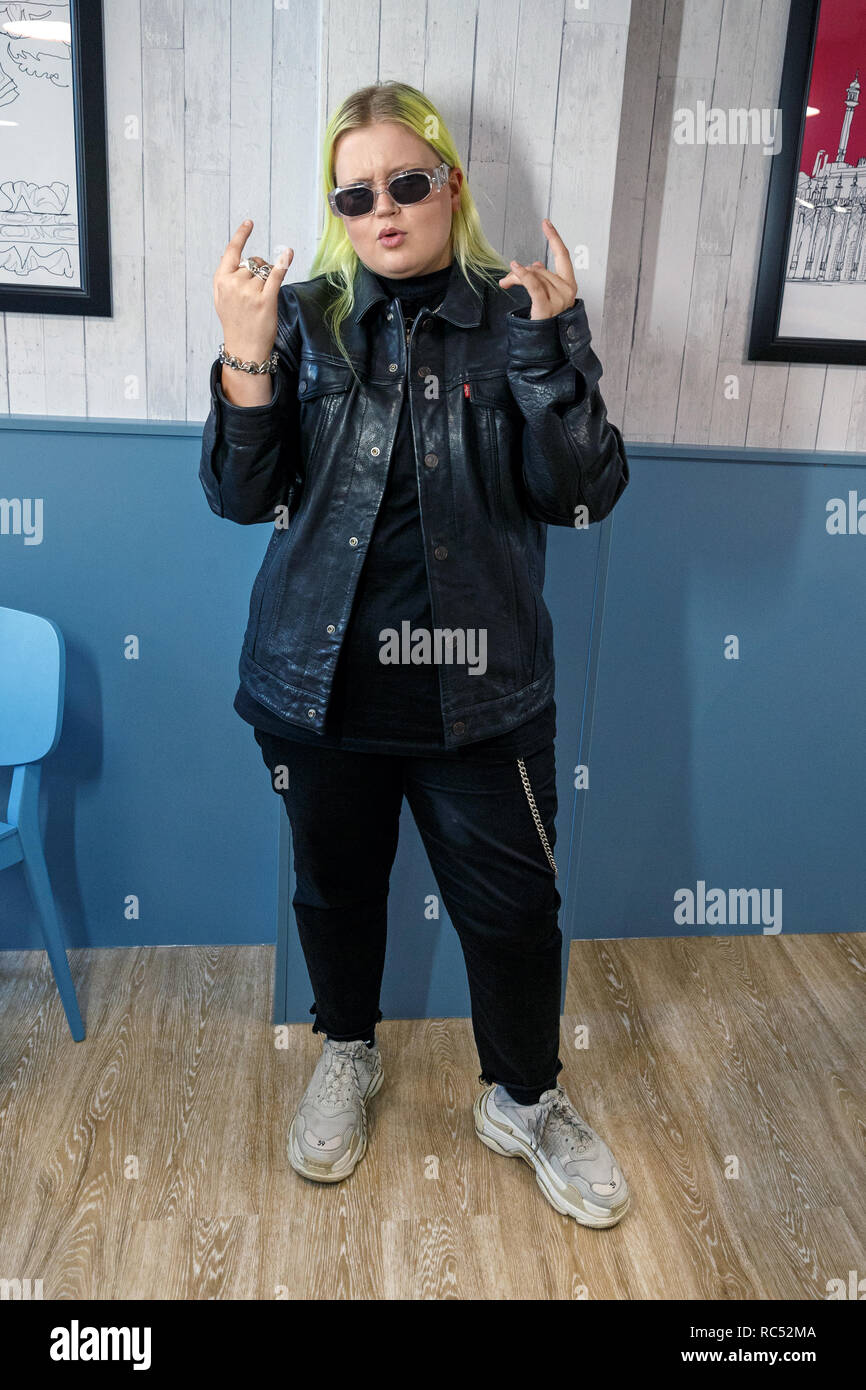 Alma, pop singer from Finland, poses for photographs in the lobby of a ...