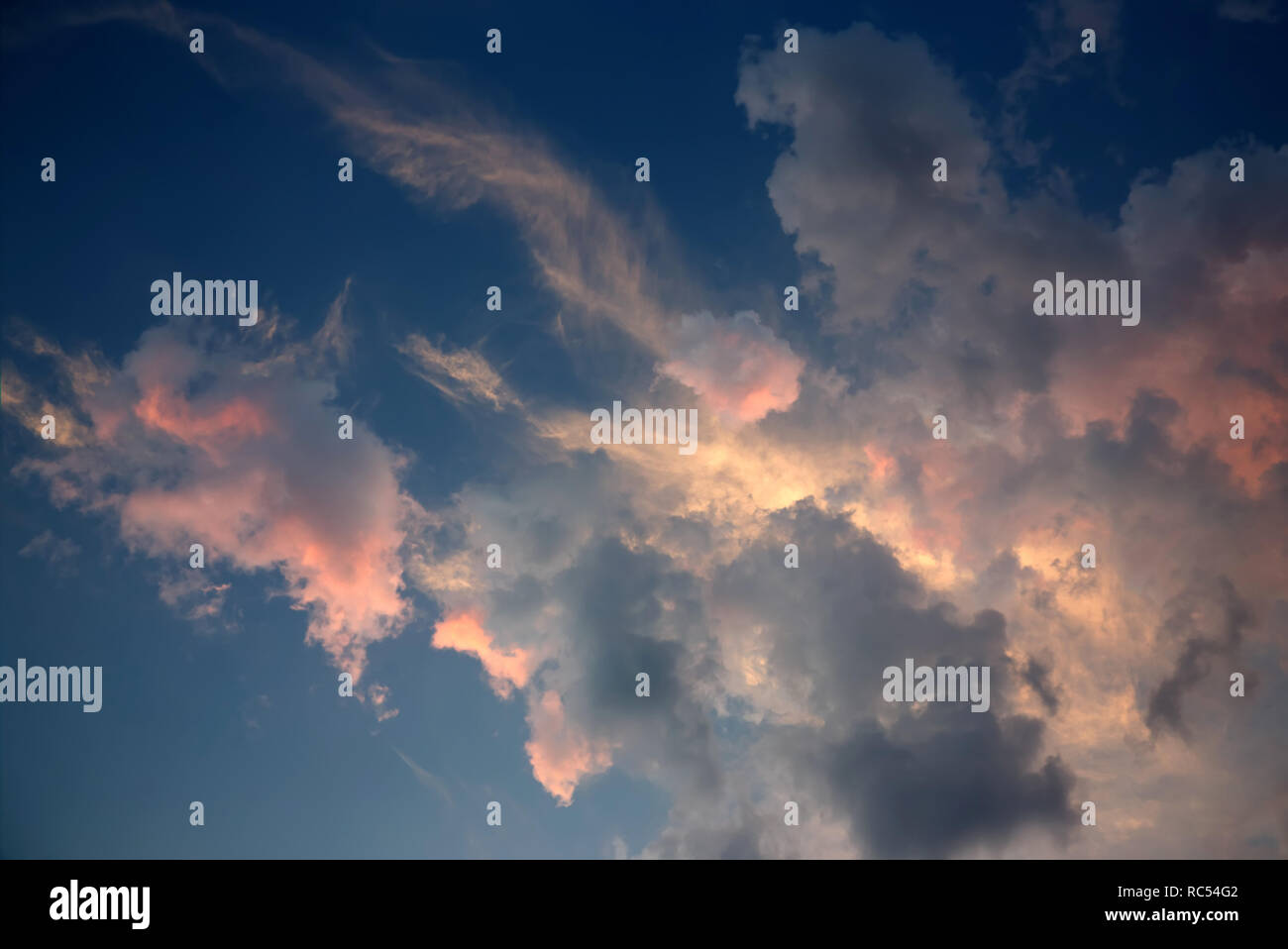 Colorful clouds on sunset sky, nature background Stock Photo - Alamy