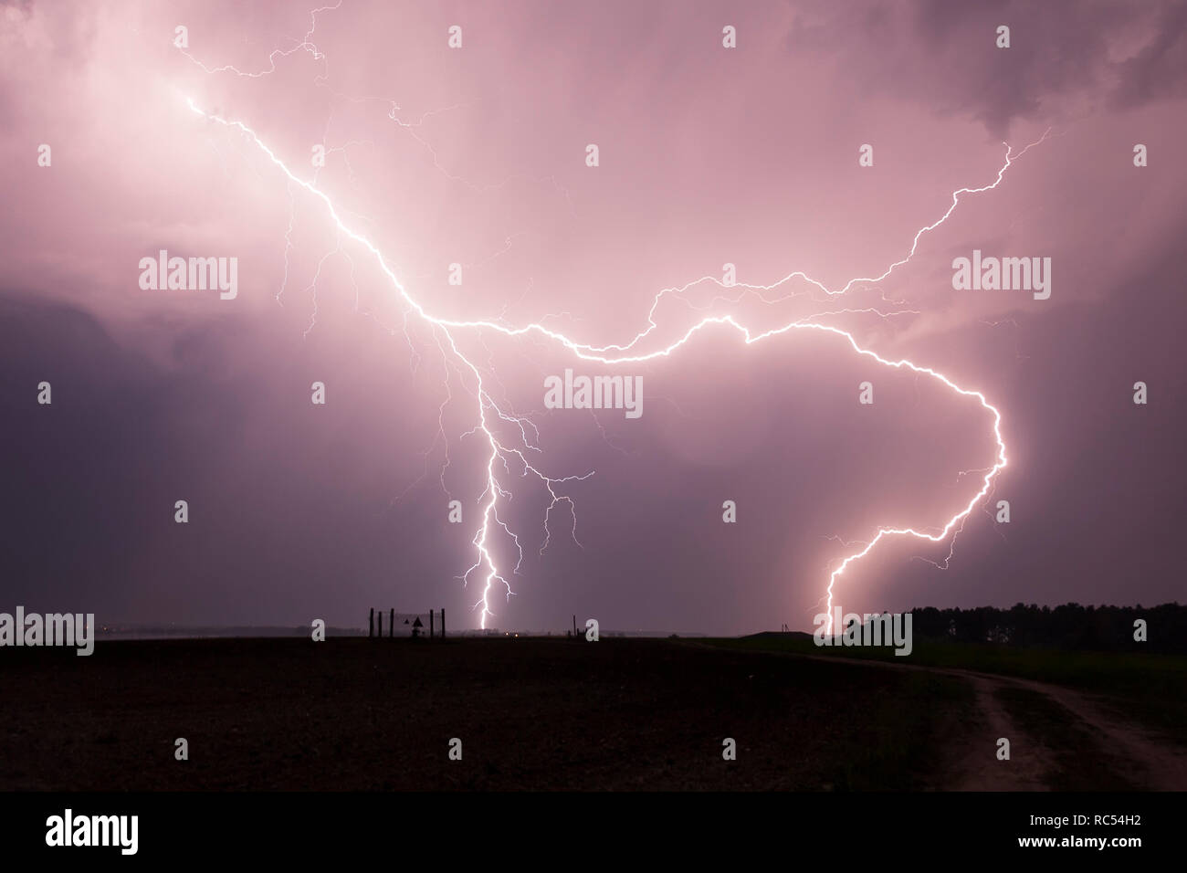 Massive Lightning Strike strikes the earth all way down Stock Photo - Alamy