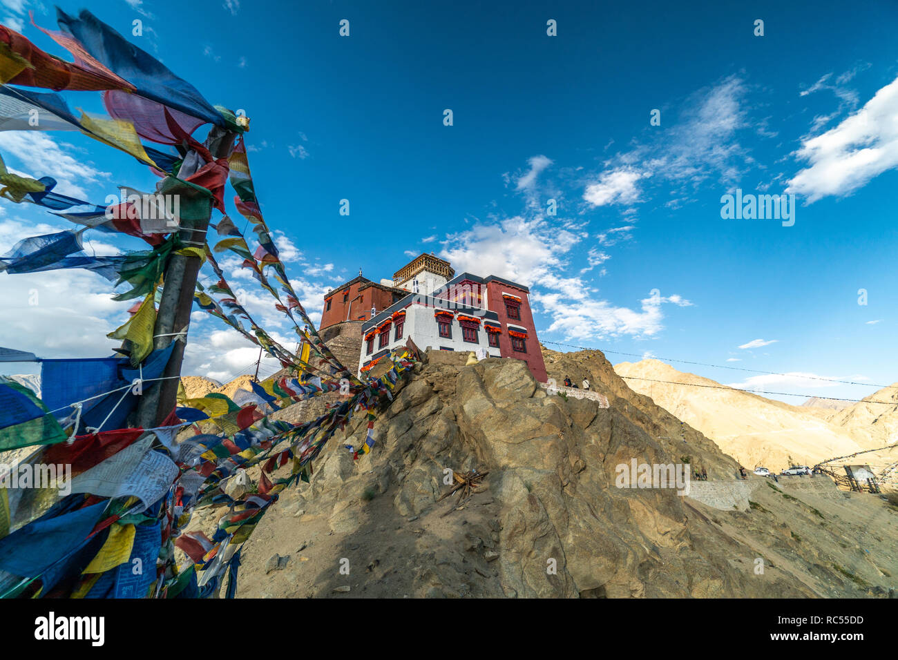 Prayer flags flapping in the wind near buddhist monastery Namgyal Tsemo ...