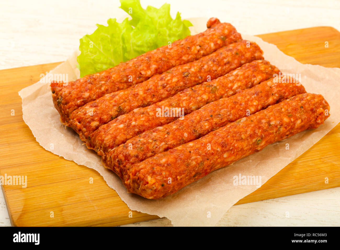 Raw beef sausages for grill Stock Photo - Alamy
