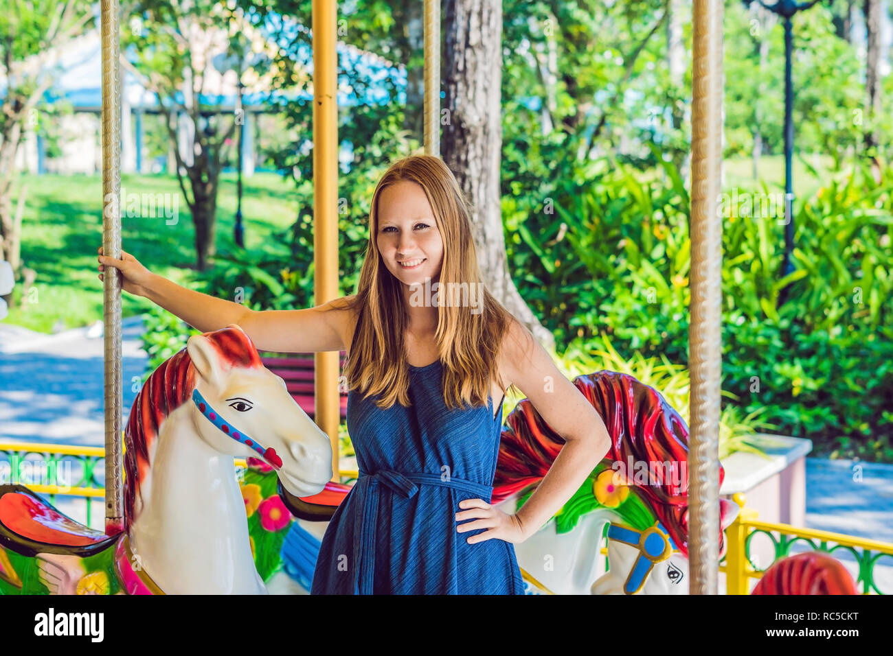 Woman riding carousel horse hi-res stock photography and images - Alamy