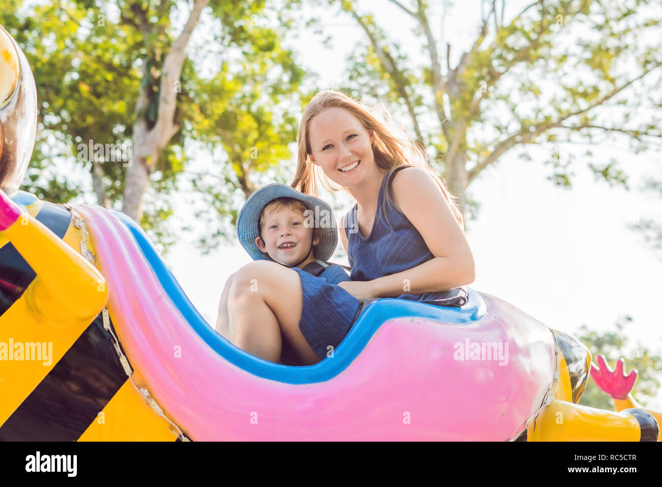 Mom and son having fun at an amusement park Stock Photo - Alamy