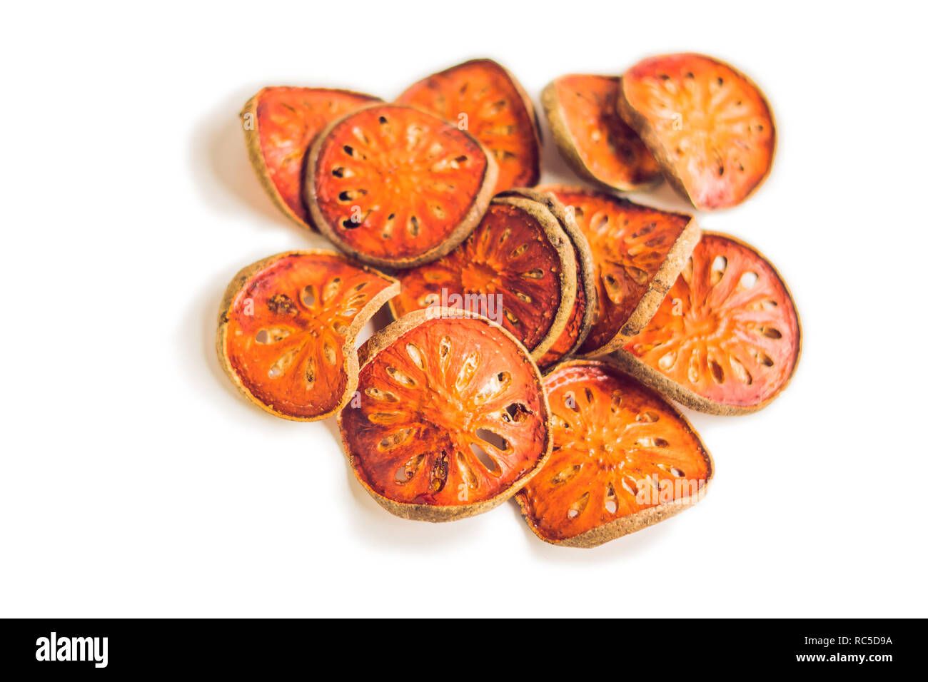 Bael fruit tea and slices of dried bael fruit, tea matum isolated on ...