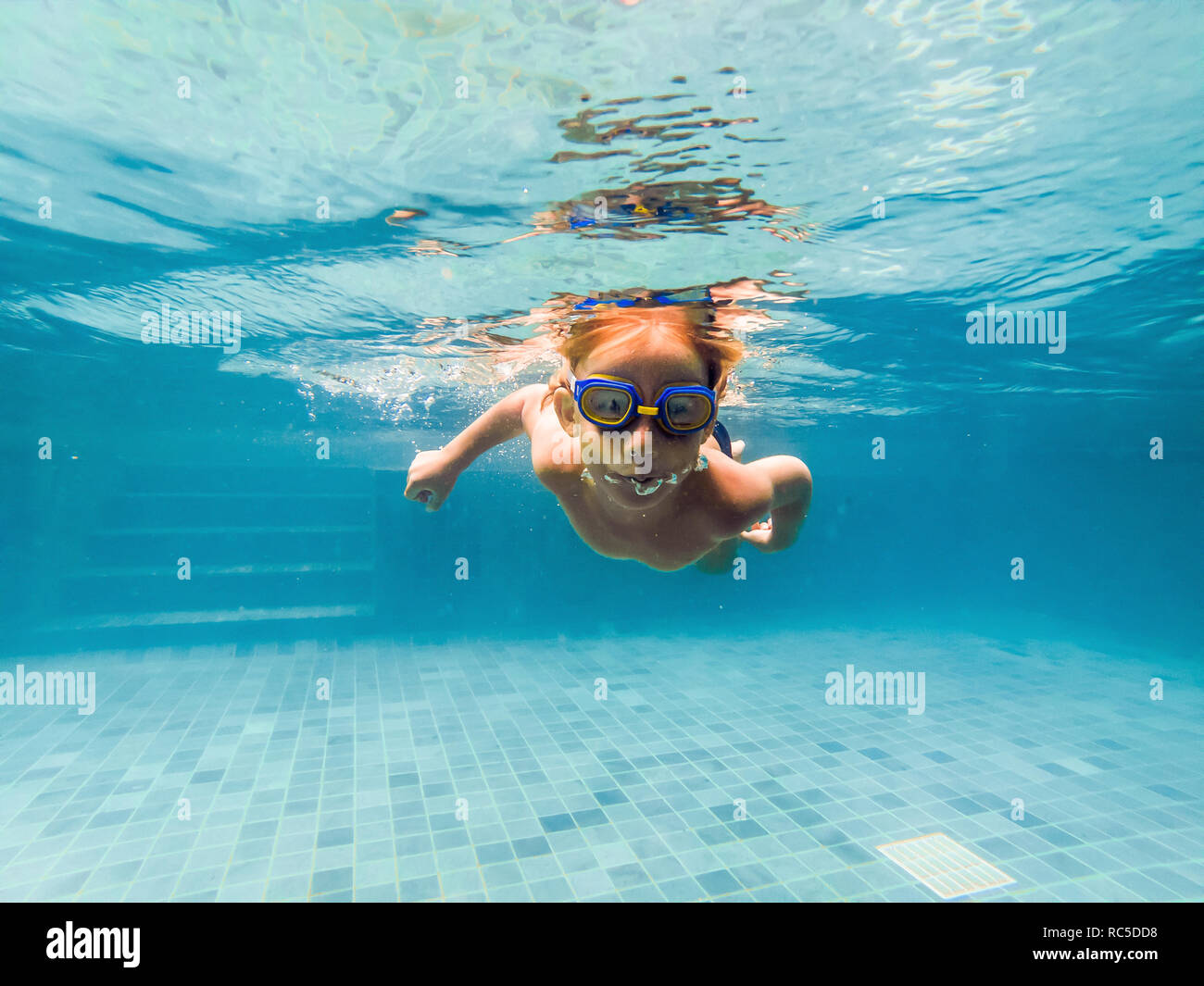 Boy holding breath underwater hi-res stock photography and images - Alamy