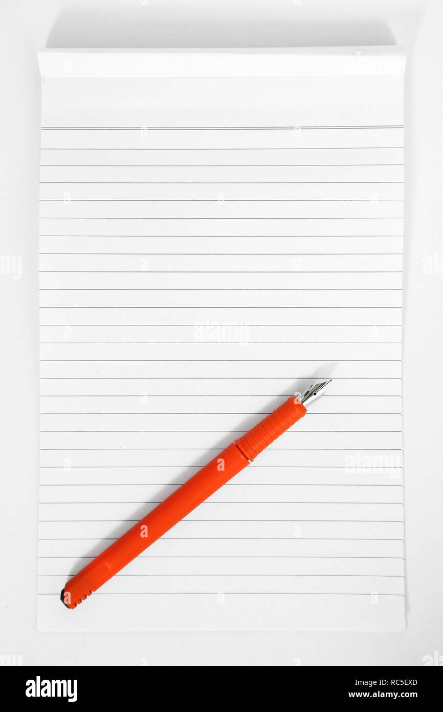 Portrait of empty notebook with pen. Isolated on the white background ...