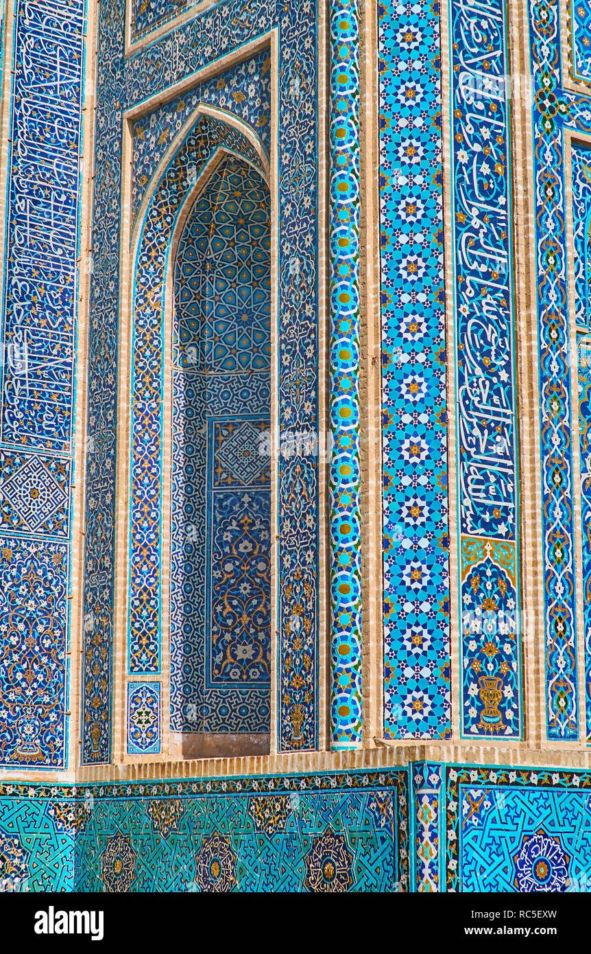 The scenic wall of the Jameh Mosque's portal with tall niche and rich ...