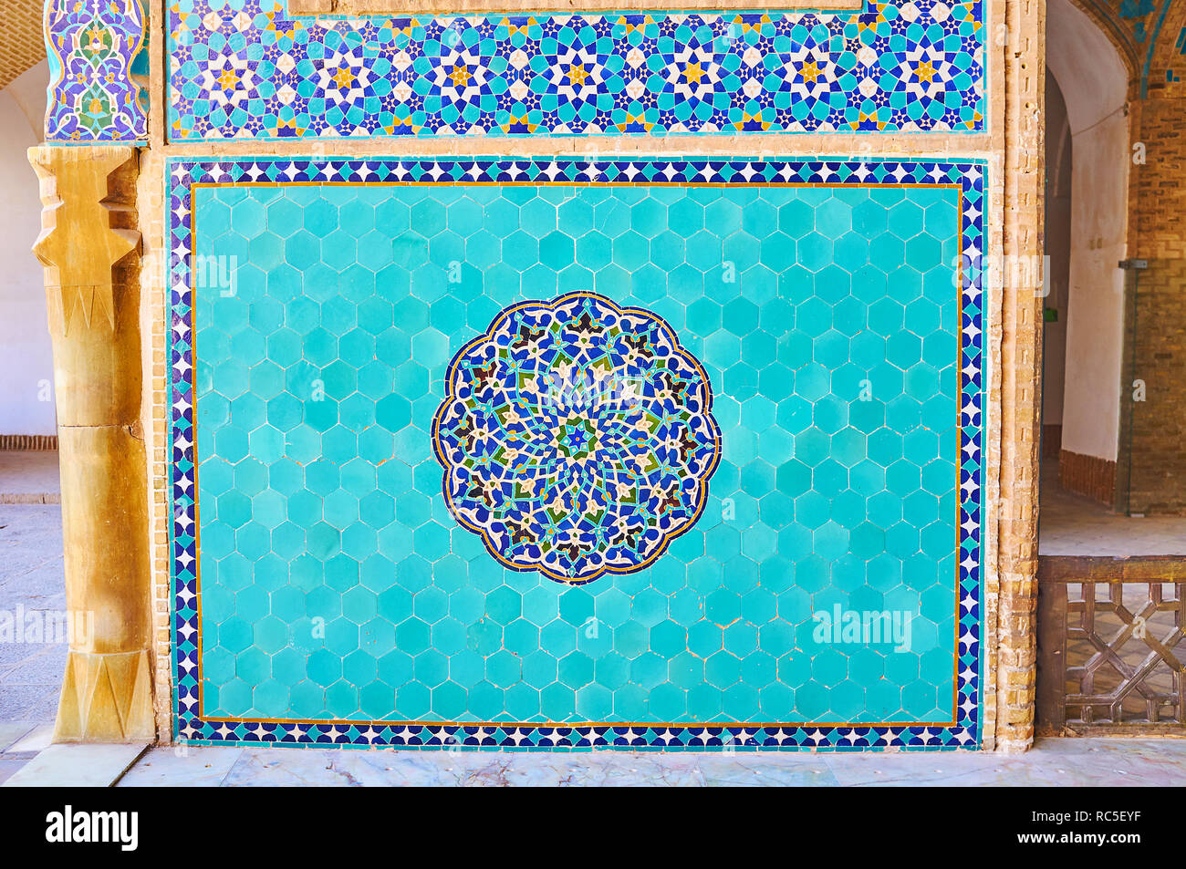 The wall of Jameh Mosque is decorated with ornate Islamic pattern ...