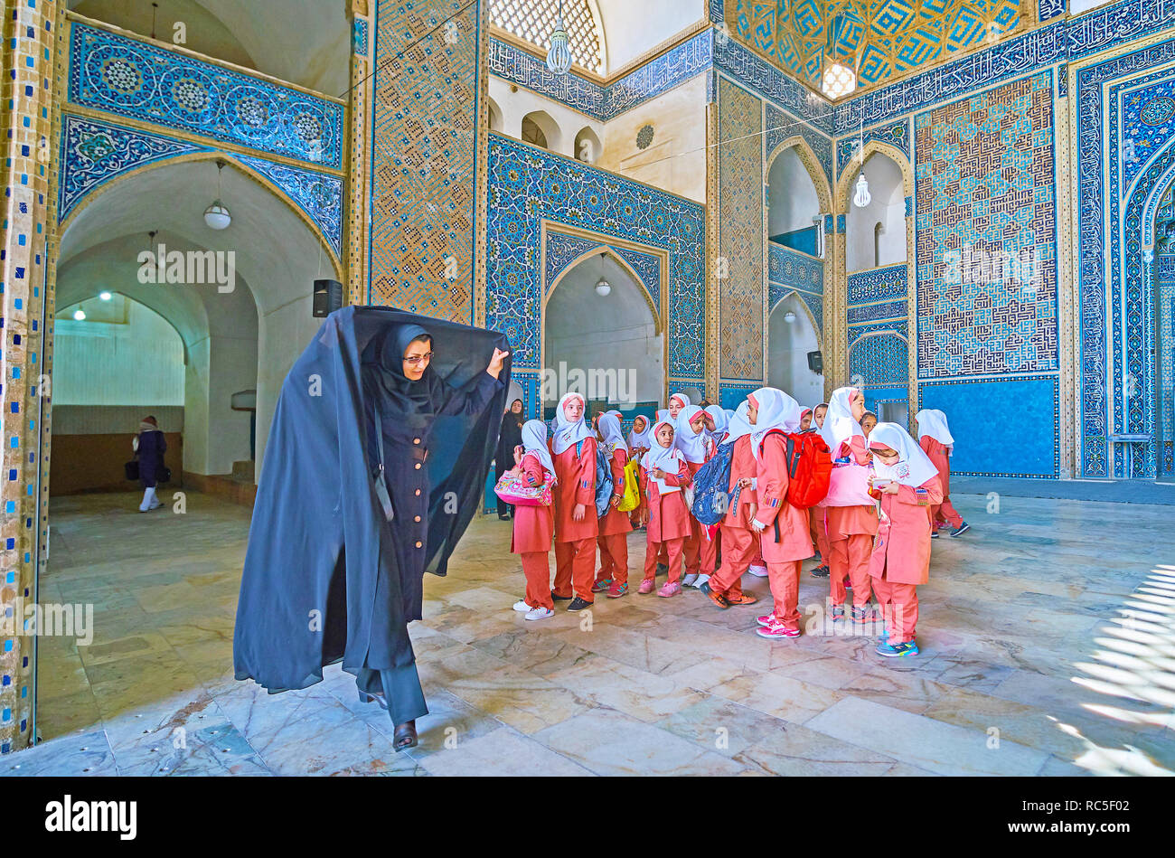YAZD, IRAN - OCTOBER 18, 2017: The group of little schoolgirls in ...