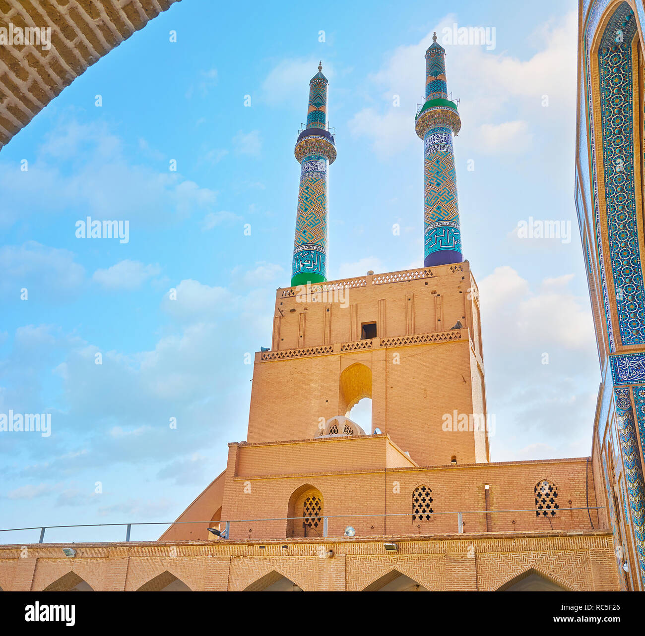 The brick backside of the portal of Jameh Mosque, topped with two ...