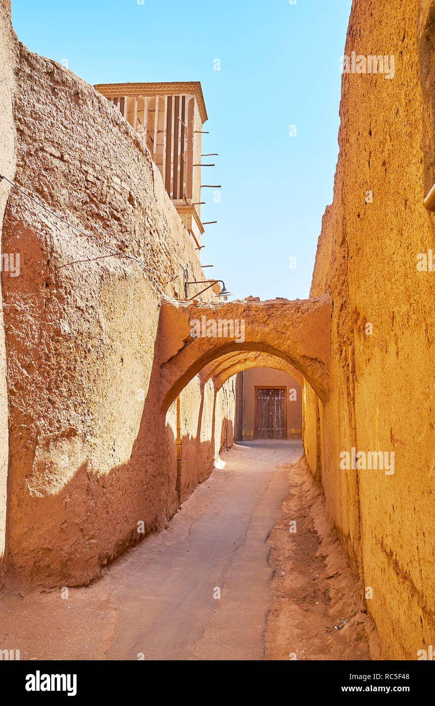 The lazy walk in medieval adobe town with a view on traditional desrt ...