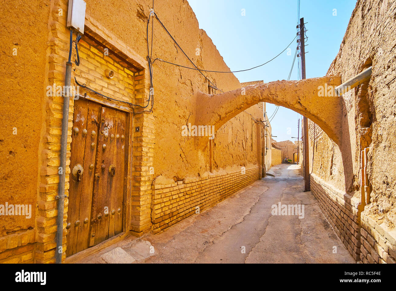 The shabby street of old town with medieval wooden door, crumbling ...