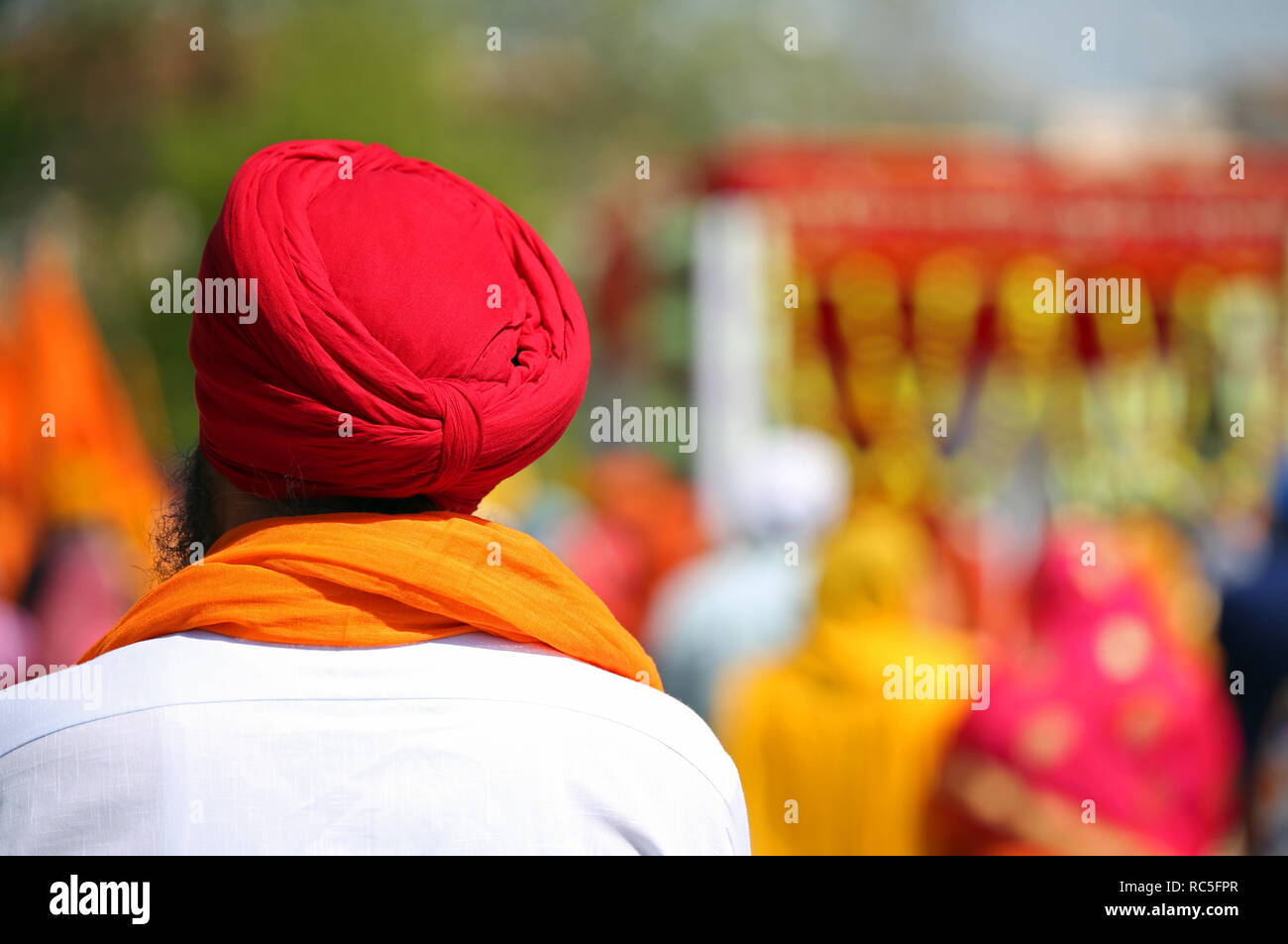 Religious manifestation and the red turban worn by a bearded man of ...