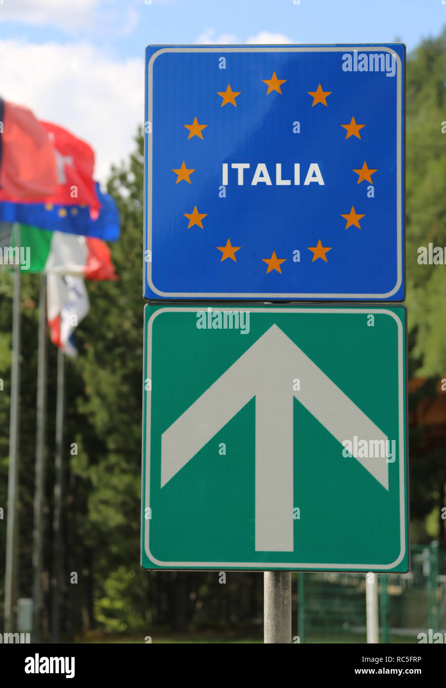road sign with the flag of the European union marking the border with ...