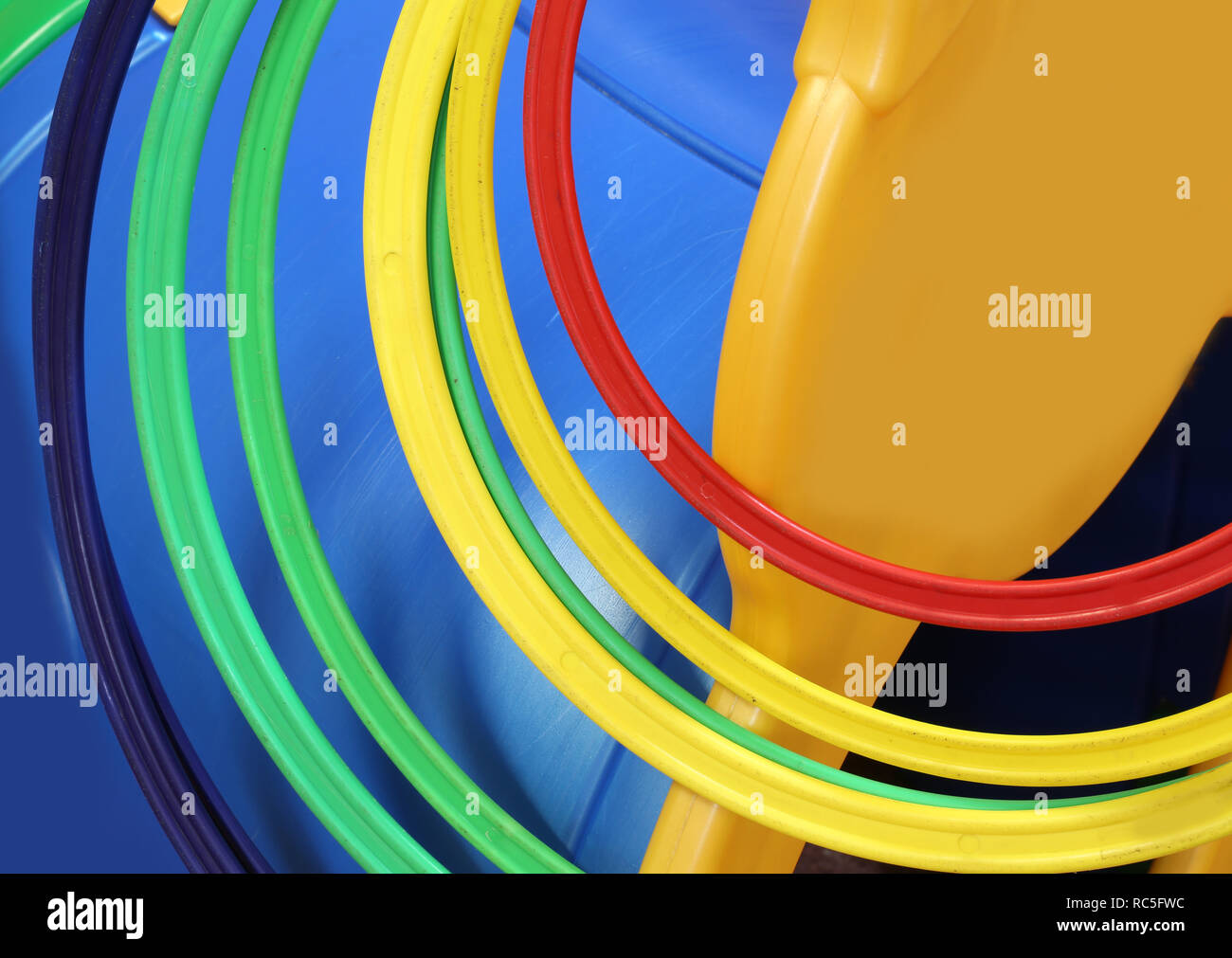 background of many colored plastic circles in a playground for children ...