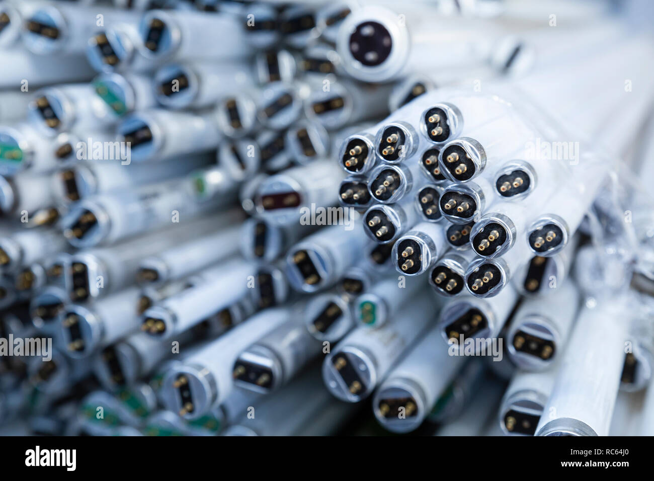 Close-up of a stack of disused and discarded neon lamp tubes waiting ...