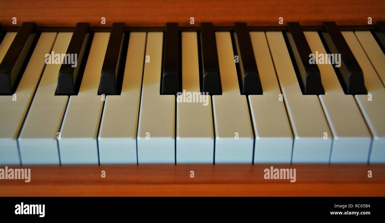Piano keys details of a wooden piano Stock Photo - Alamy