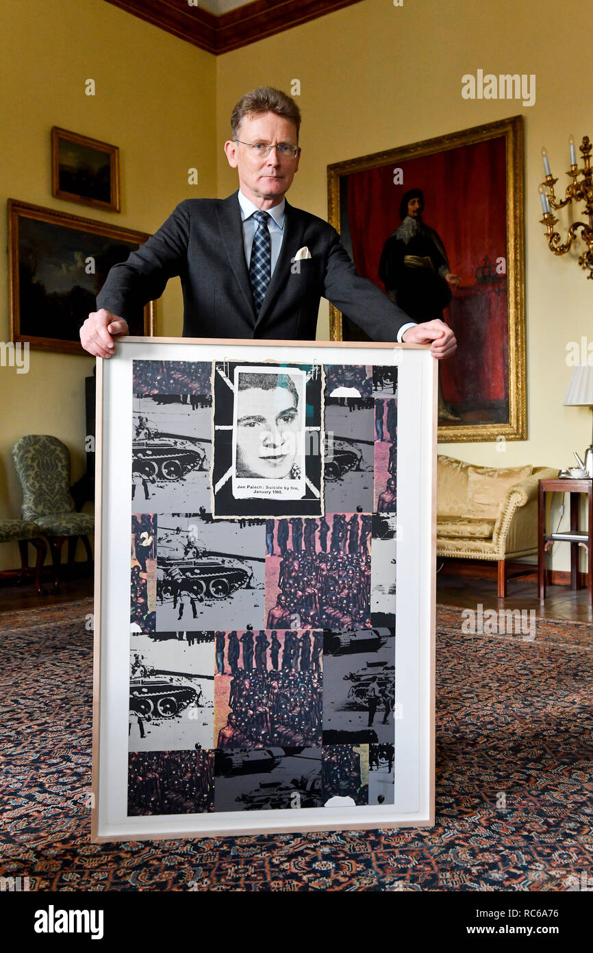 British Ambassador in Czech Republic Nick Archer shows the collage work ...