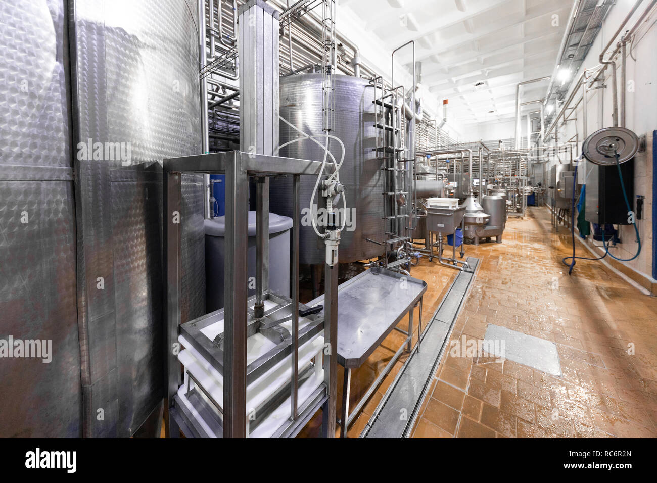 Cheese-making equipment of cheese factory background Stock Photo - Alamy