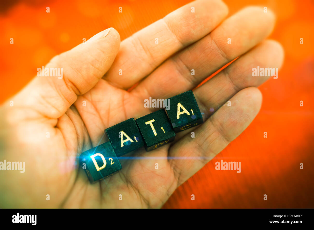 Letter cubes forming the word data on a hand Stock Photo - Alamy