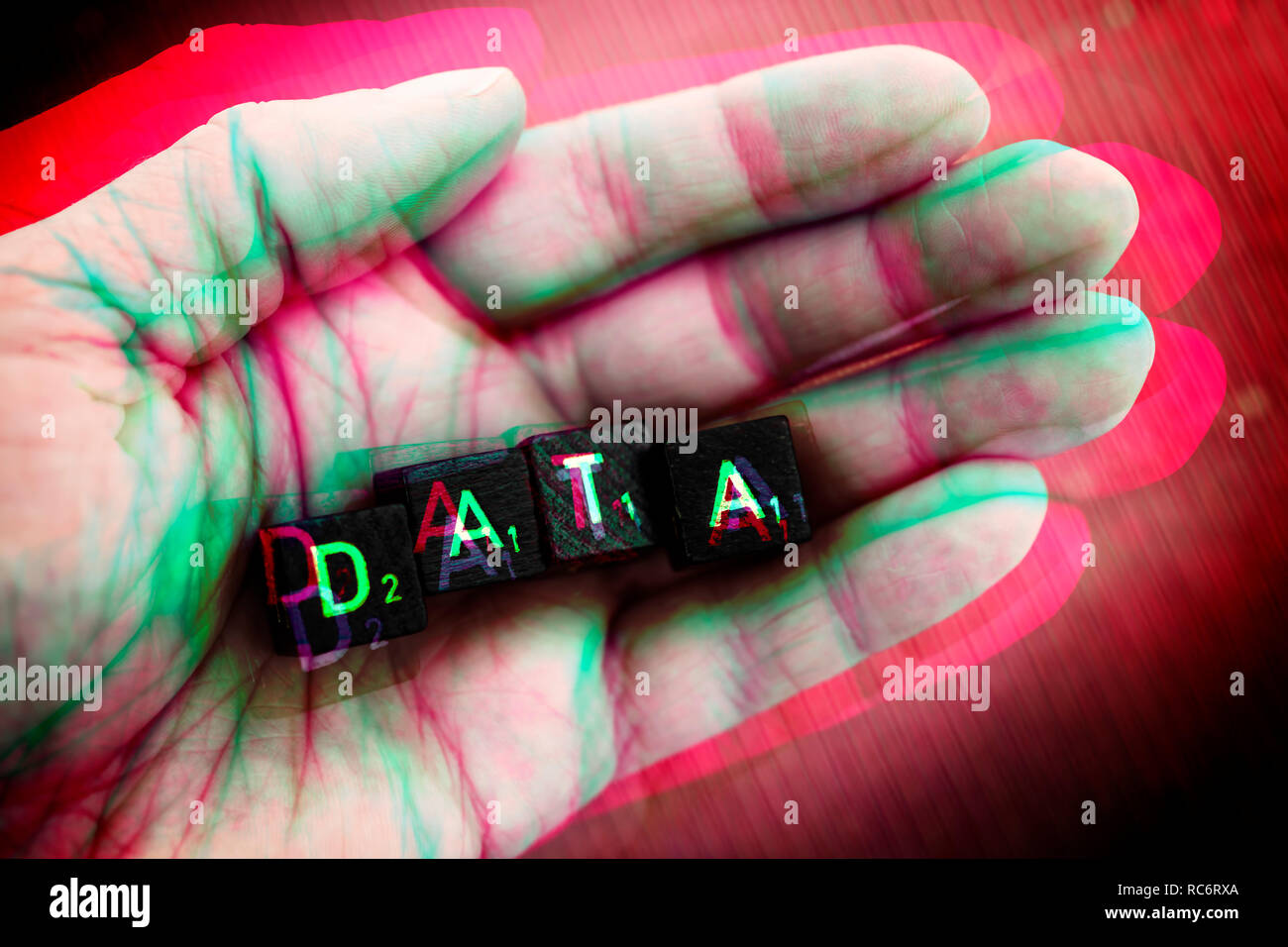 Letter cubes forming the word data on a hand Stock Photo - Alamy