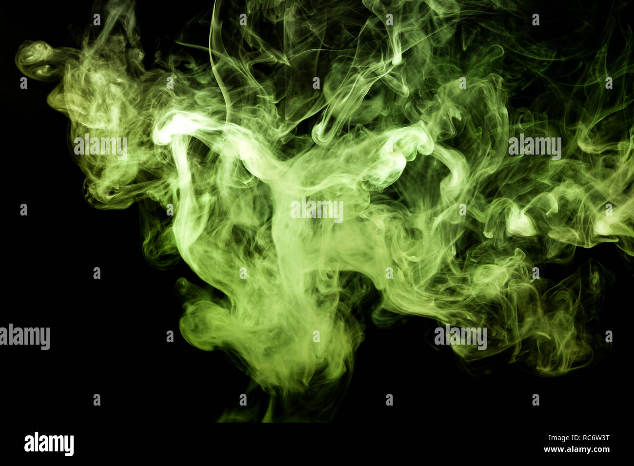 Colorful green smoke on a black isolated background. Background from ...