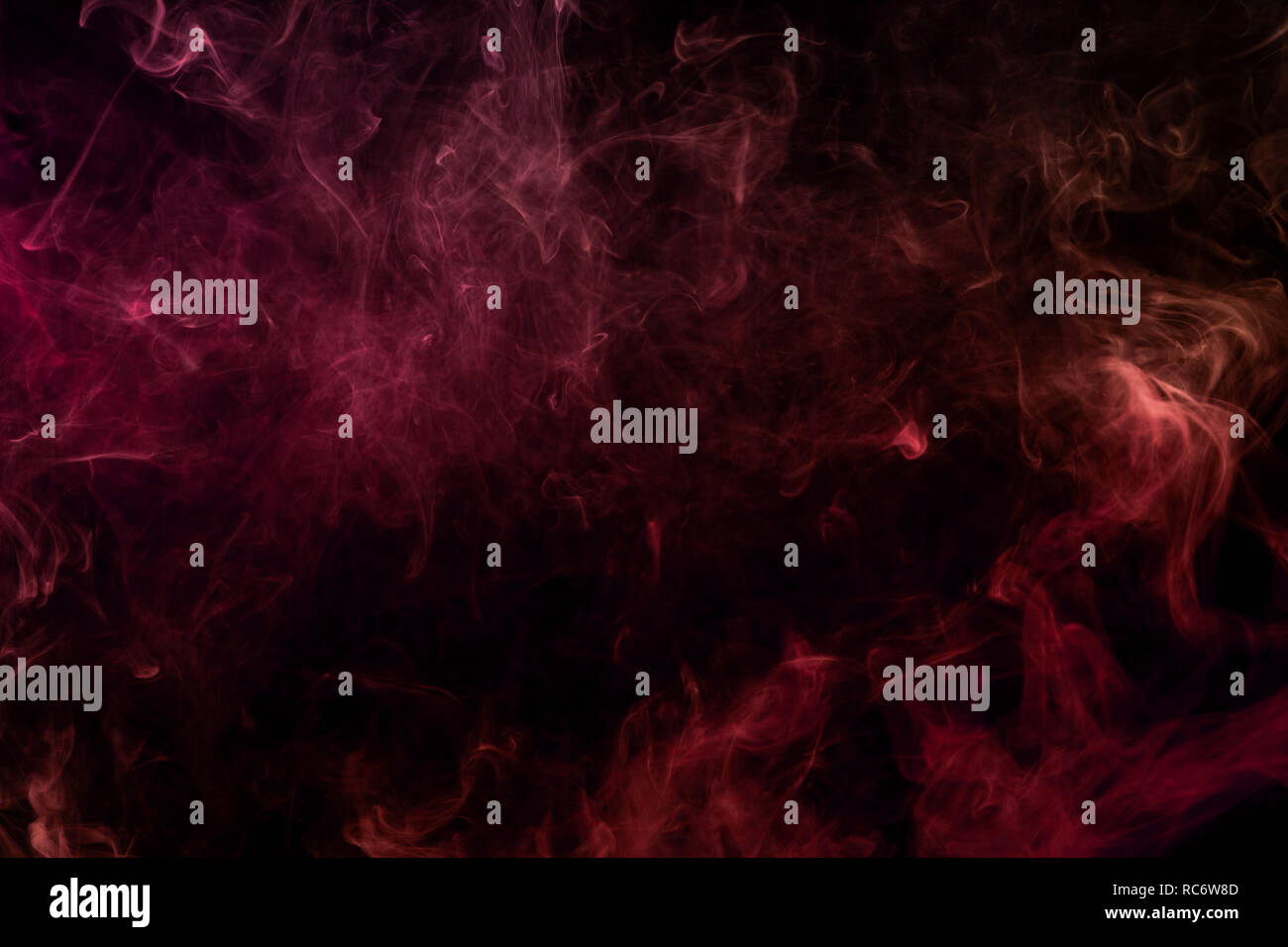 Thick yellow and red smoke on a black isolated background. Background ...