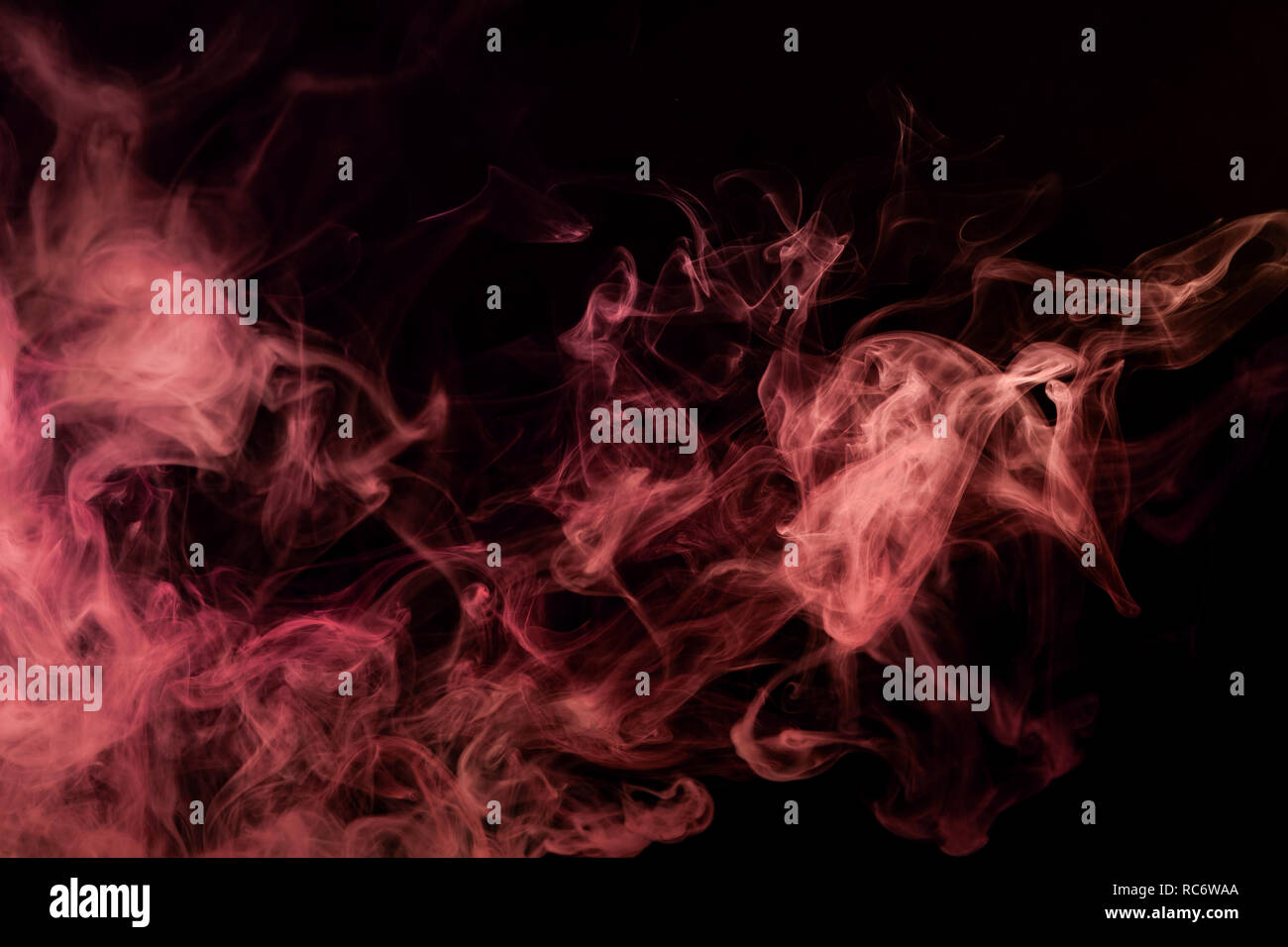Thick yellow and red smoke on a black isolated background. Background ...