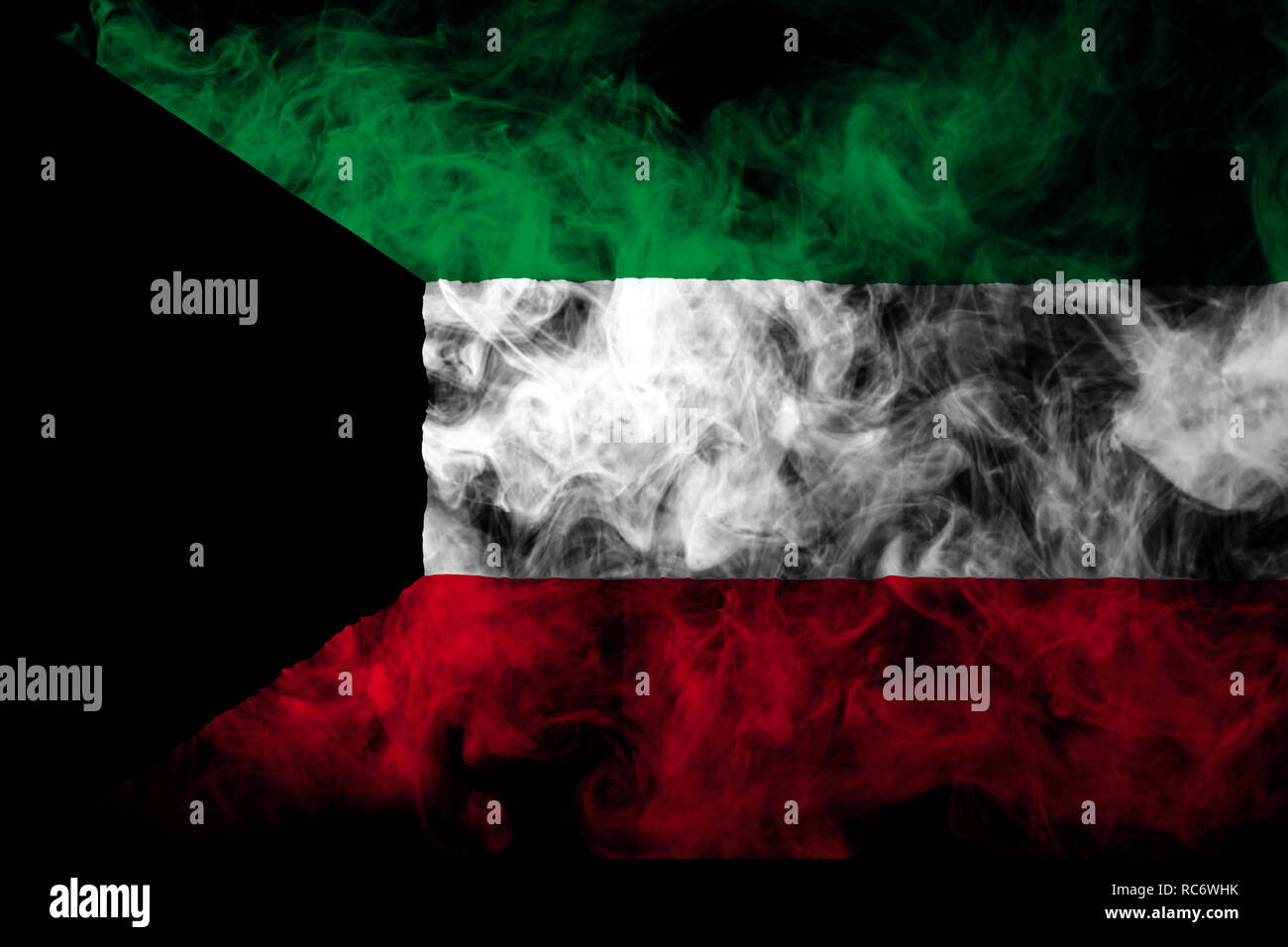 National flag of Kuwait from thick colored smoke on a black isolated ...