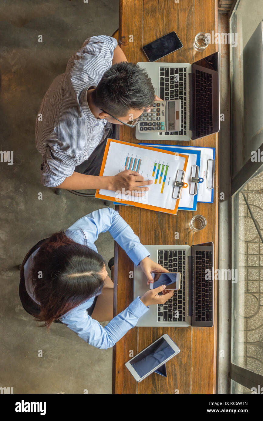 Business employee reading report and texting message Stock Photo - Alamy