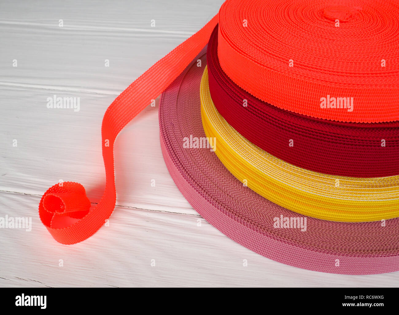 Ribbon of different colors in coils Stock Photo - Alamy