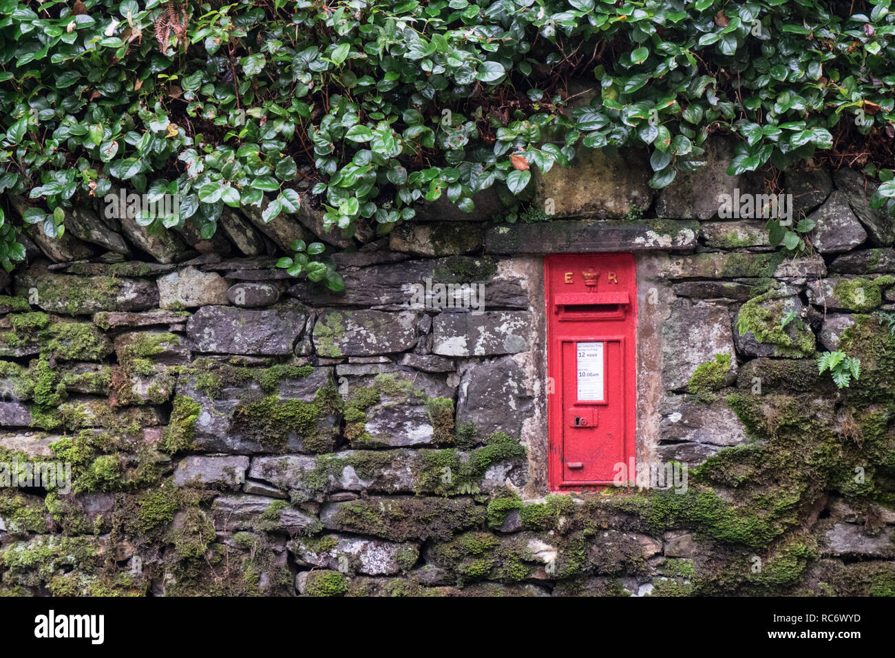 Country post box in slate wall with ivy and moss Stock Photo - Alamy