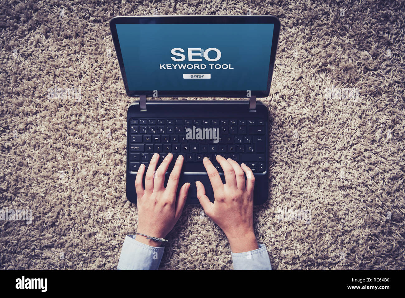 SEO positioning work with a laptop, with hands typing on the keyboard ...