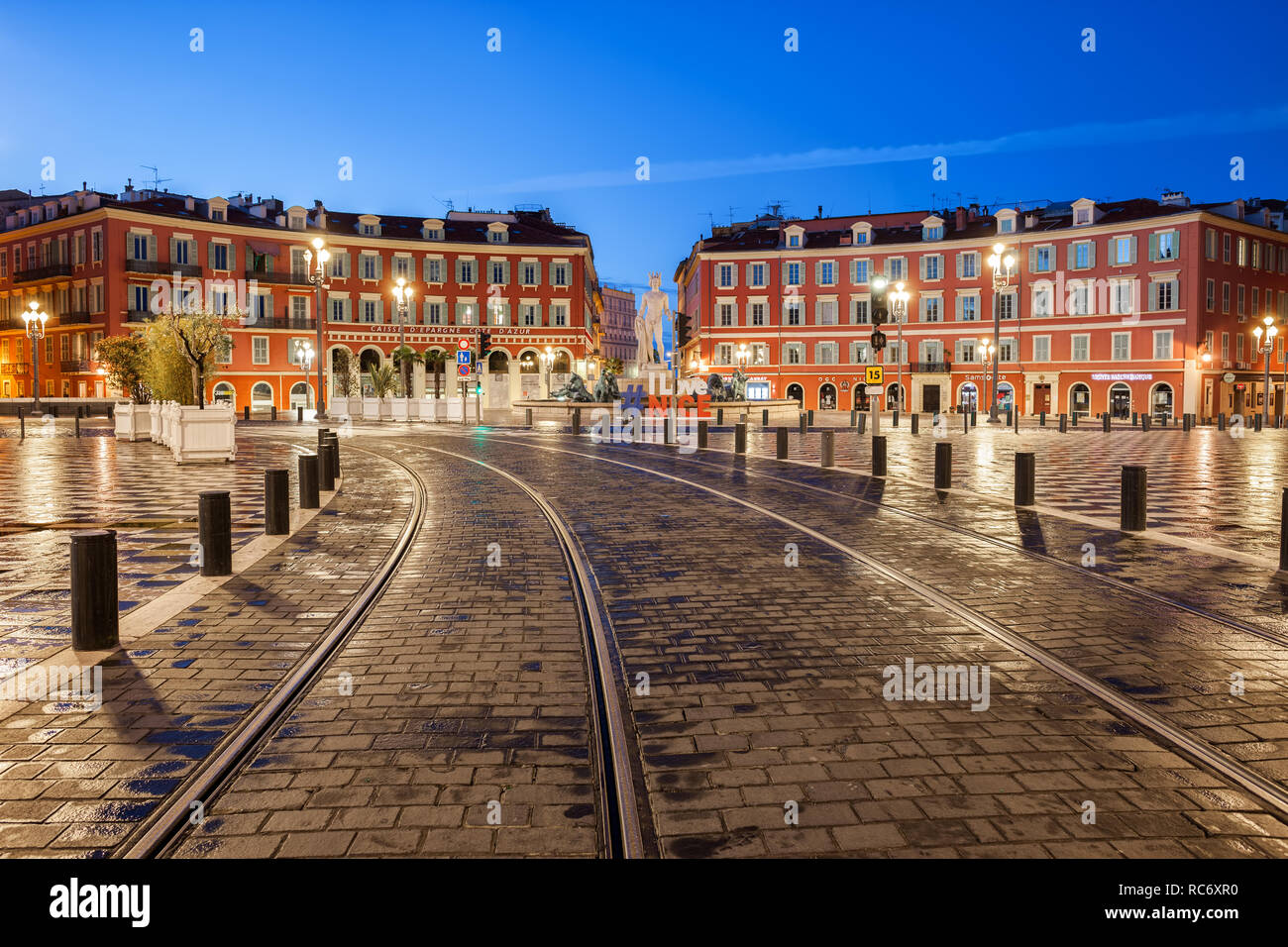 France, Nice, tramway track on Place Massena at dawn, main city square ...