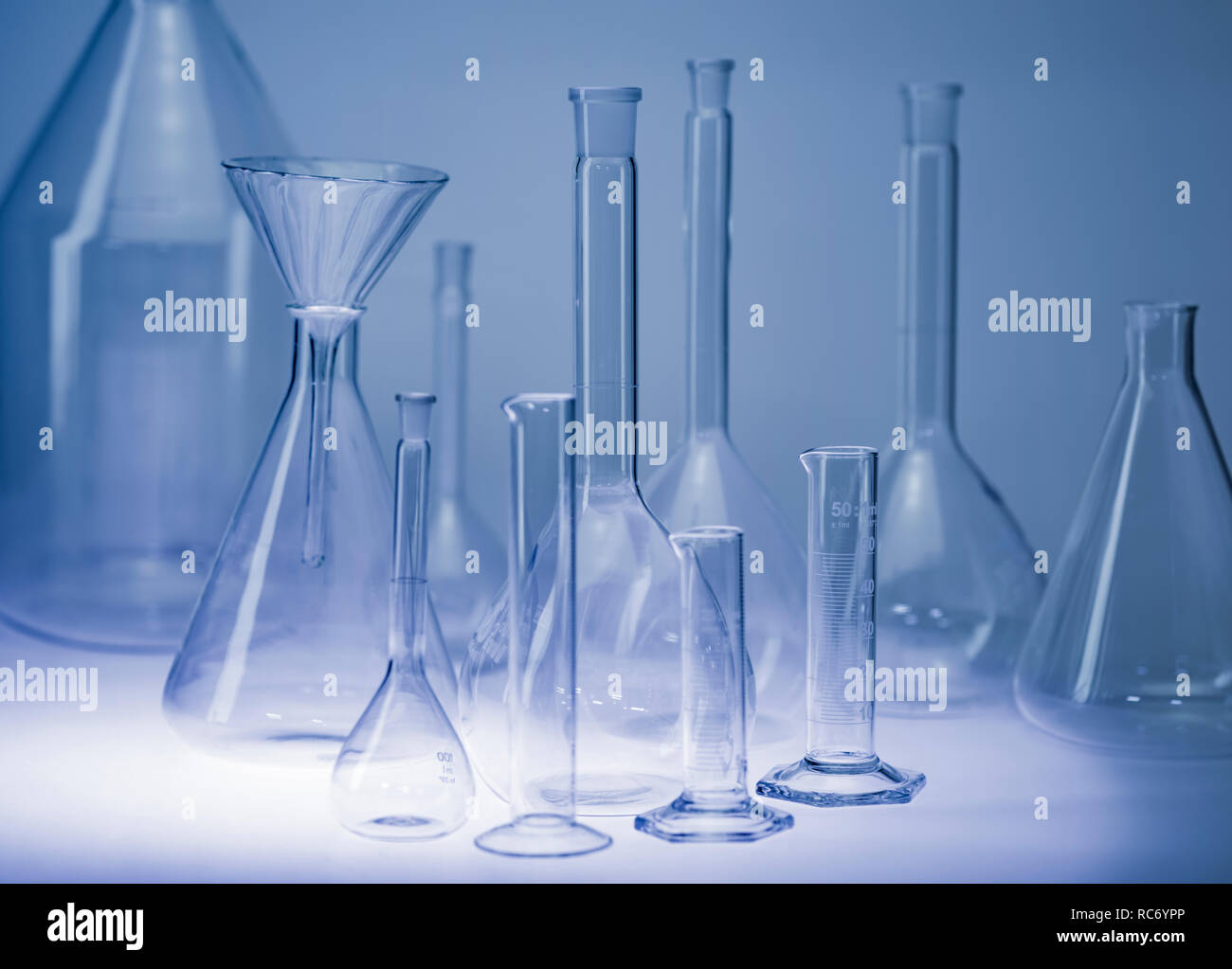 variety of laboratory glassware in blue ambiance Stock Photo - Alamy