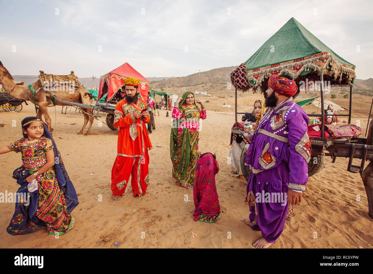 Pushkar Desert, Rajasthan, India, February 2018: Traditinally dressed ...