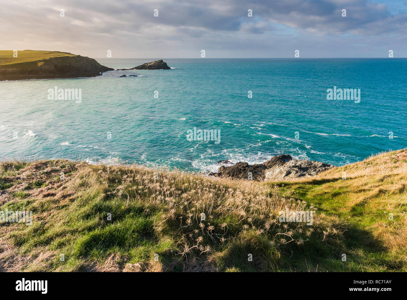 A view over Porth Joke Beach Polly Joke towards the small rocky island ...