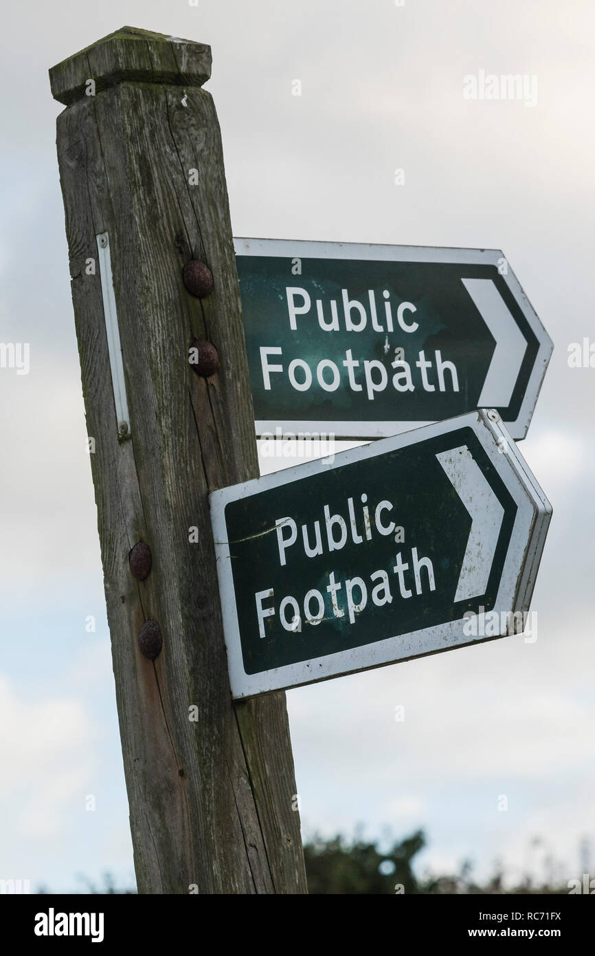 A signpost giving direction to public footpaths Stock Photo - Alamy
