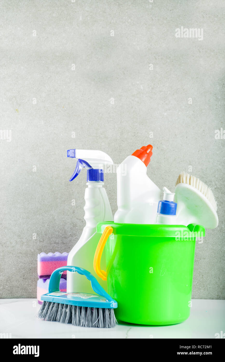 Cleaning concept with different cleaning supplies, on gray stone ...