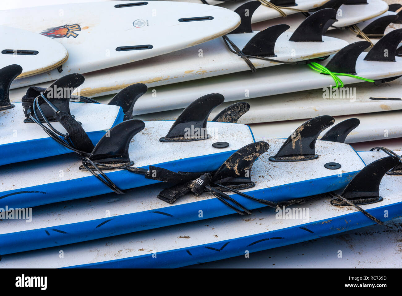 A stack of surfboards showing the surfboard fins Stock Photo - Alamy