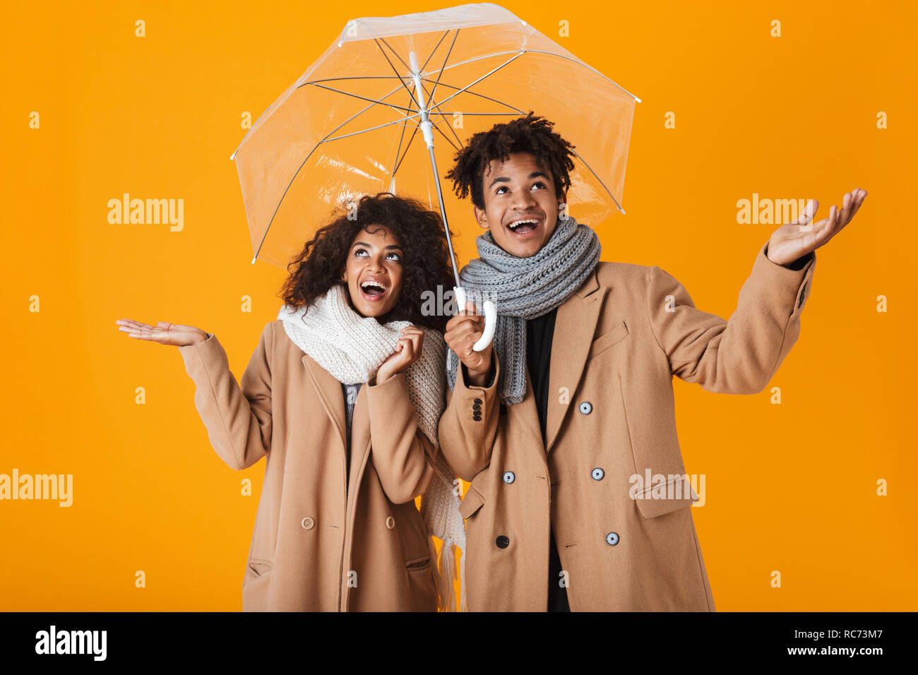 Two People Standing Under An Umbrella In The Rain