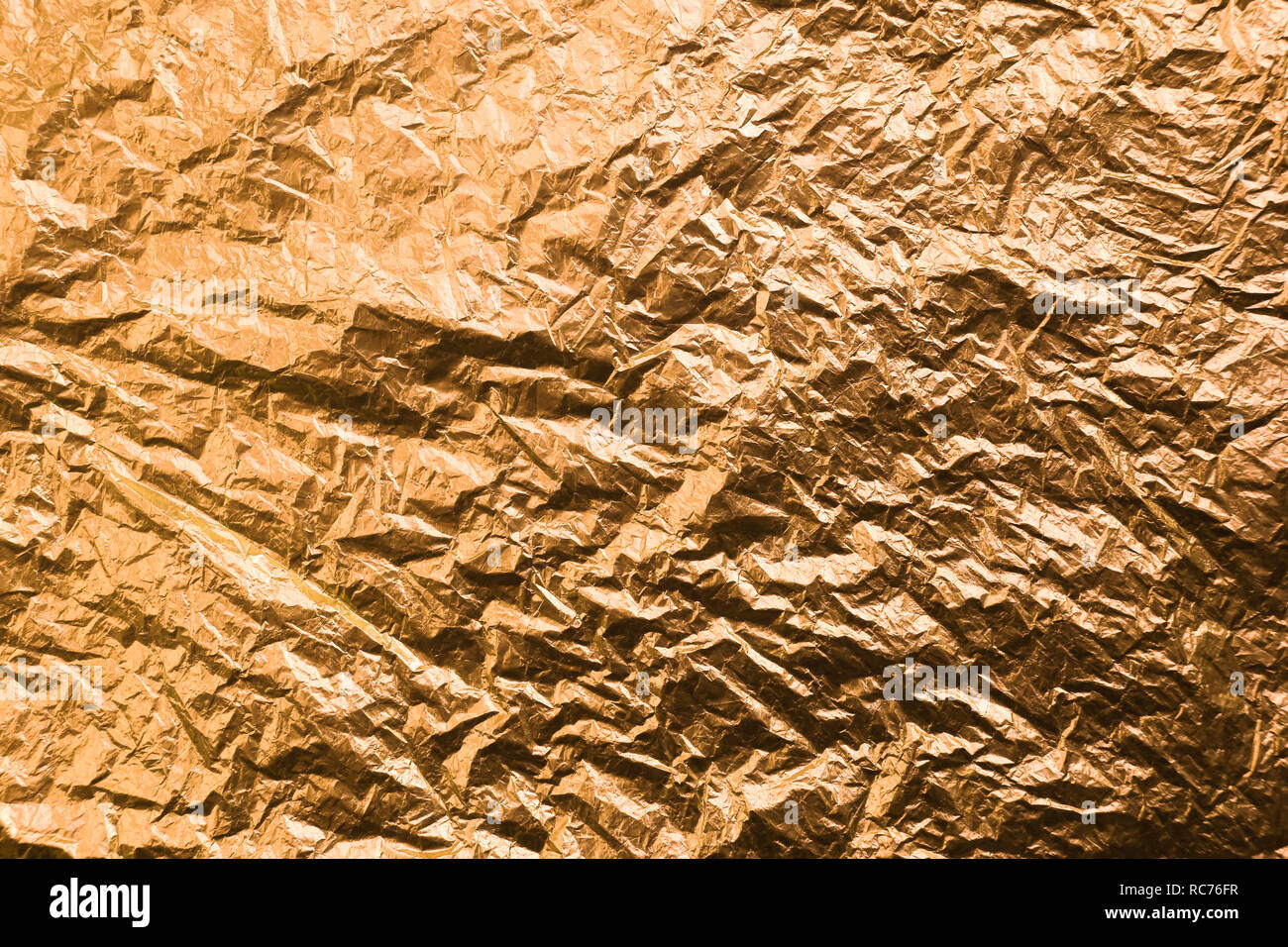 Gold textured background. Crumpled colored paper Stock Photo - Alamy