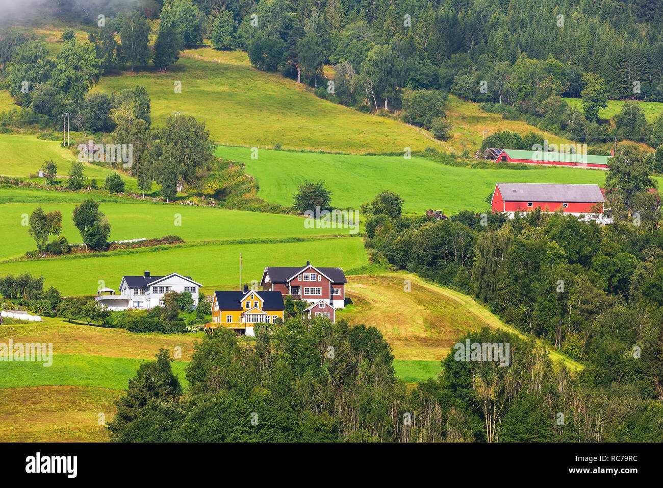Norwegian fjord village landscape with mountains and colorful houses in ...