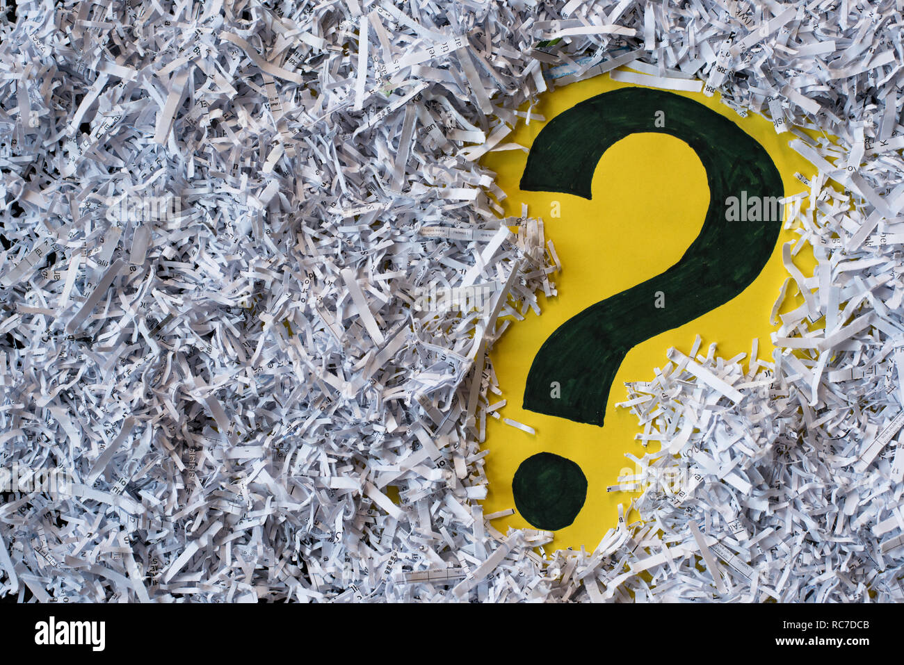 Question mark symbol in a shredded paper. Concept of confidential ...