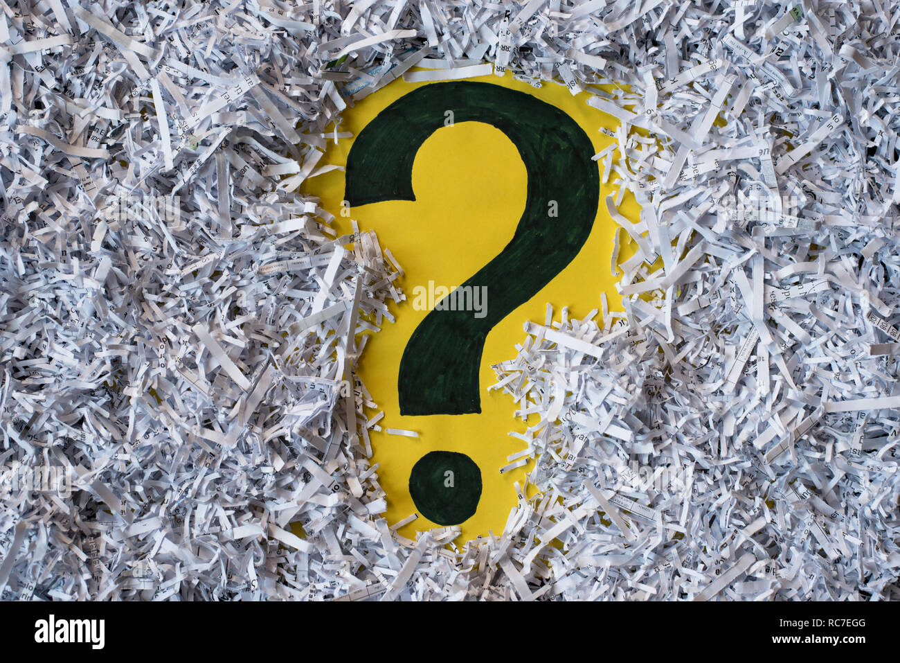 Question mark symbol in a shredded paper. Concept of confidential ...