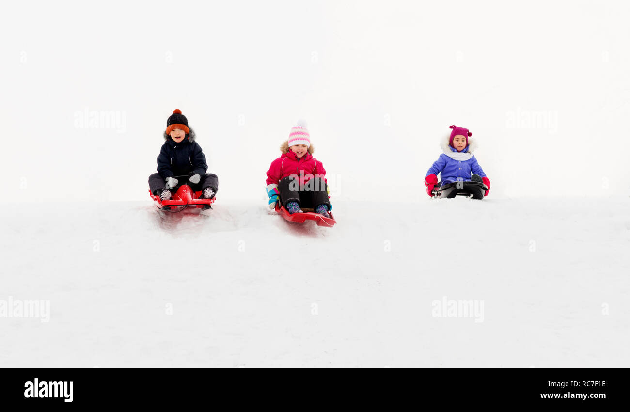 Child girl people person riding sledge sliding snow hi-res stock ...